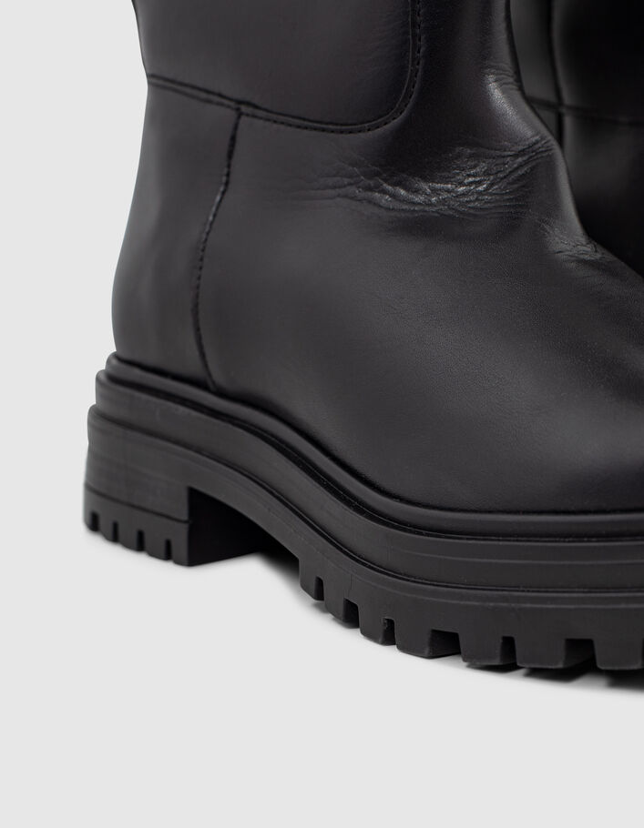 Women’s black leather high boots with lugged soles