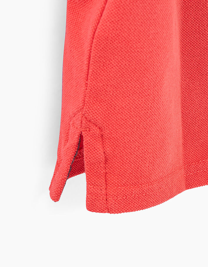 Boys’ coral polo shirt with surfboard embroidery on back