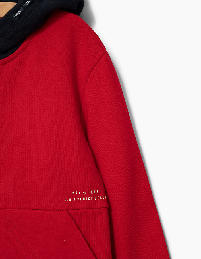 Boys' medium red cardigan with navy hood