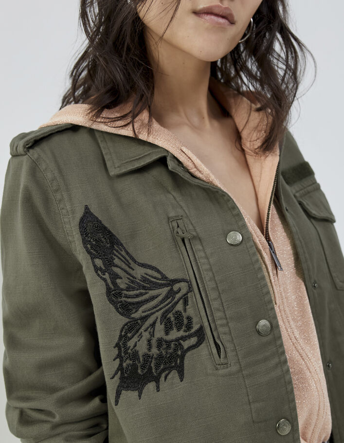 Women’s khaki safari jacket, black butterfly embroidery