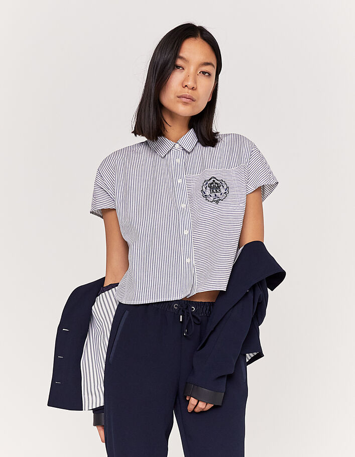 Women’s cropped sleeveless shirt + insignia badge on chest