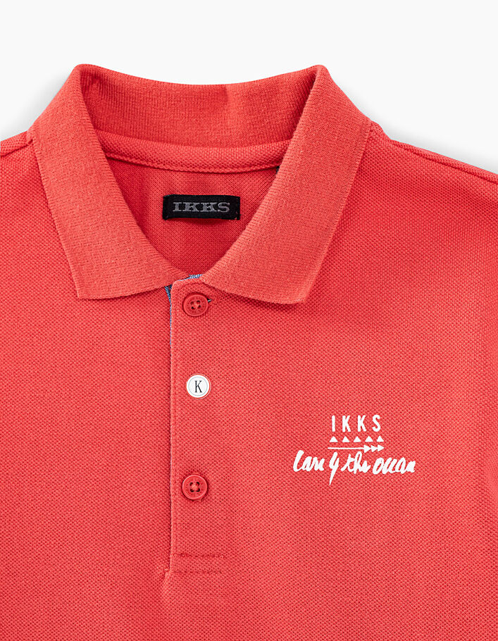 Boys’ coral polo shirt with surfboard embroidery on back