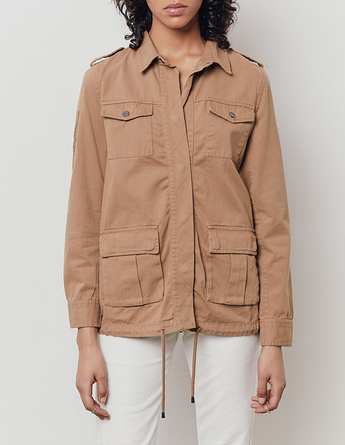 Women’s beige long safari-style jacket with motif on back